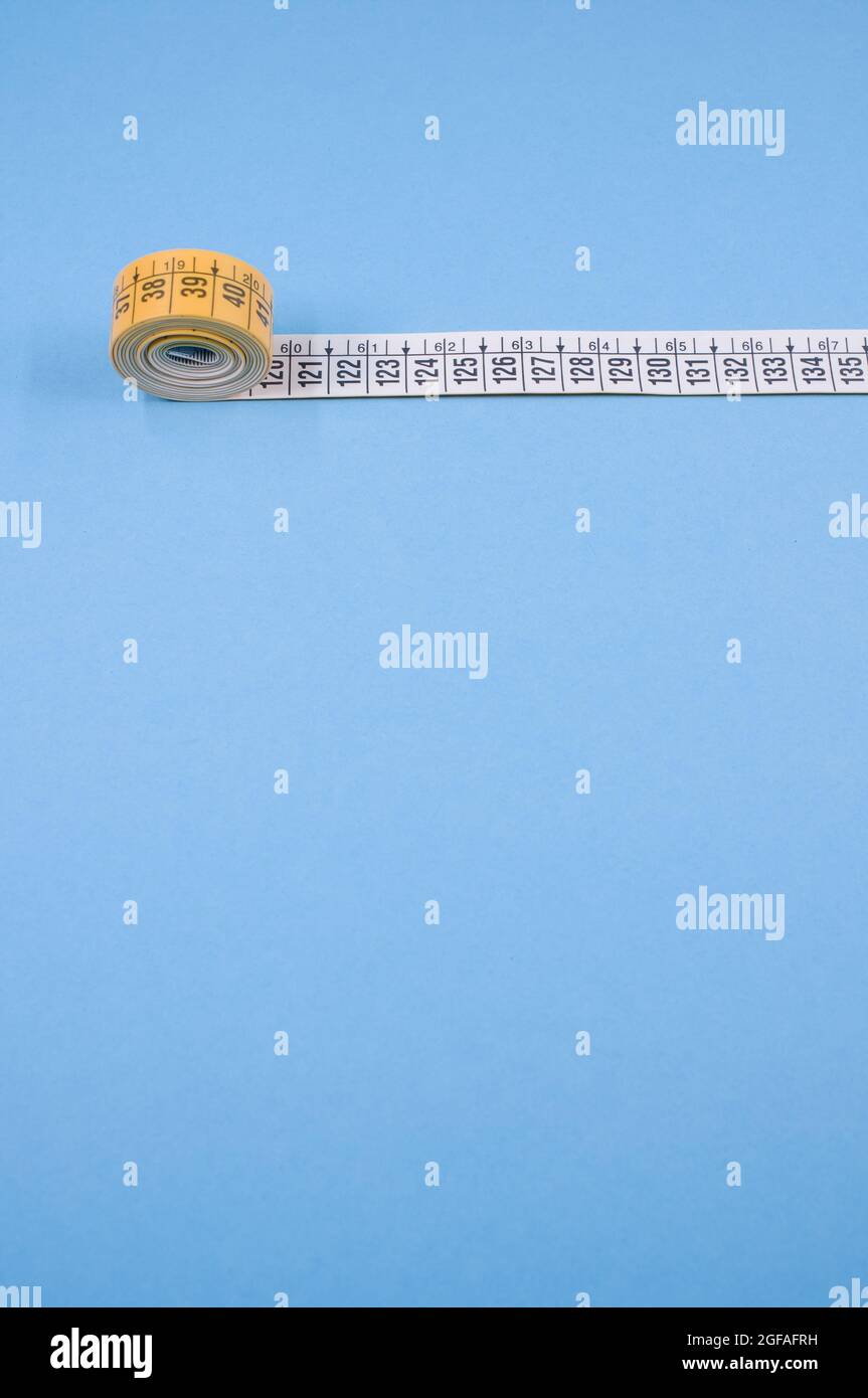 Top view of a roll meter on a yellow background Stock Photo - Alamy