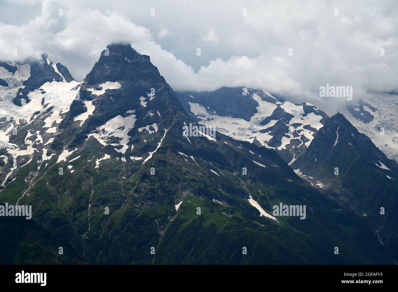 Mountain range with dramatic clouds Stock Photo - Alamy