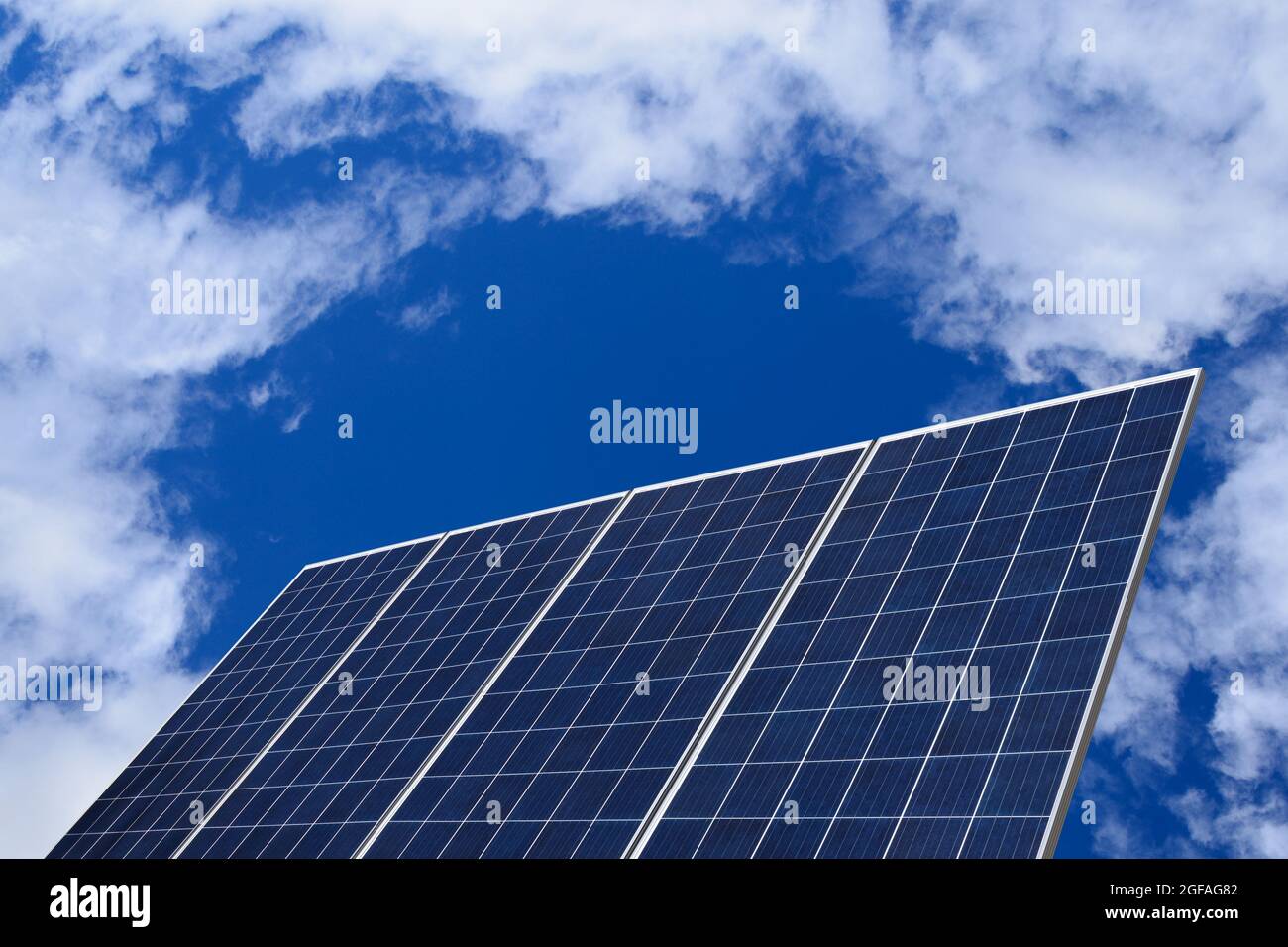 Solar panel on blue sky background Stock Photo - Alamy