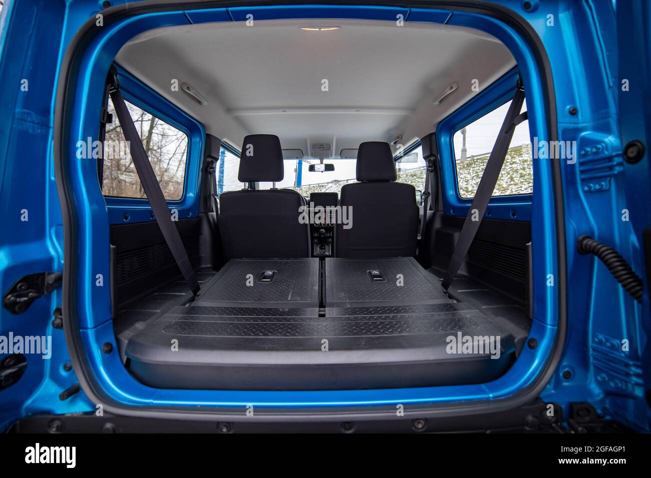 open empty car trunk with seats folded into flat flor of hatchback ...