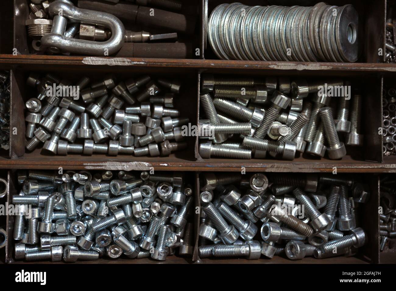 Screw nuts and other details sorted in a box Stock Photo - Alamy