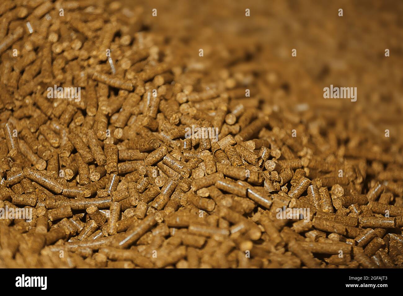 Solid wooden pellets background Stock Photo - Alamy