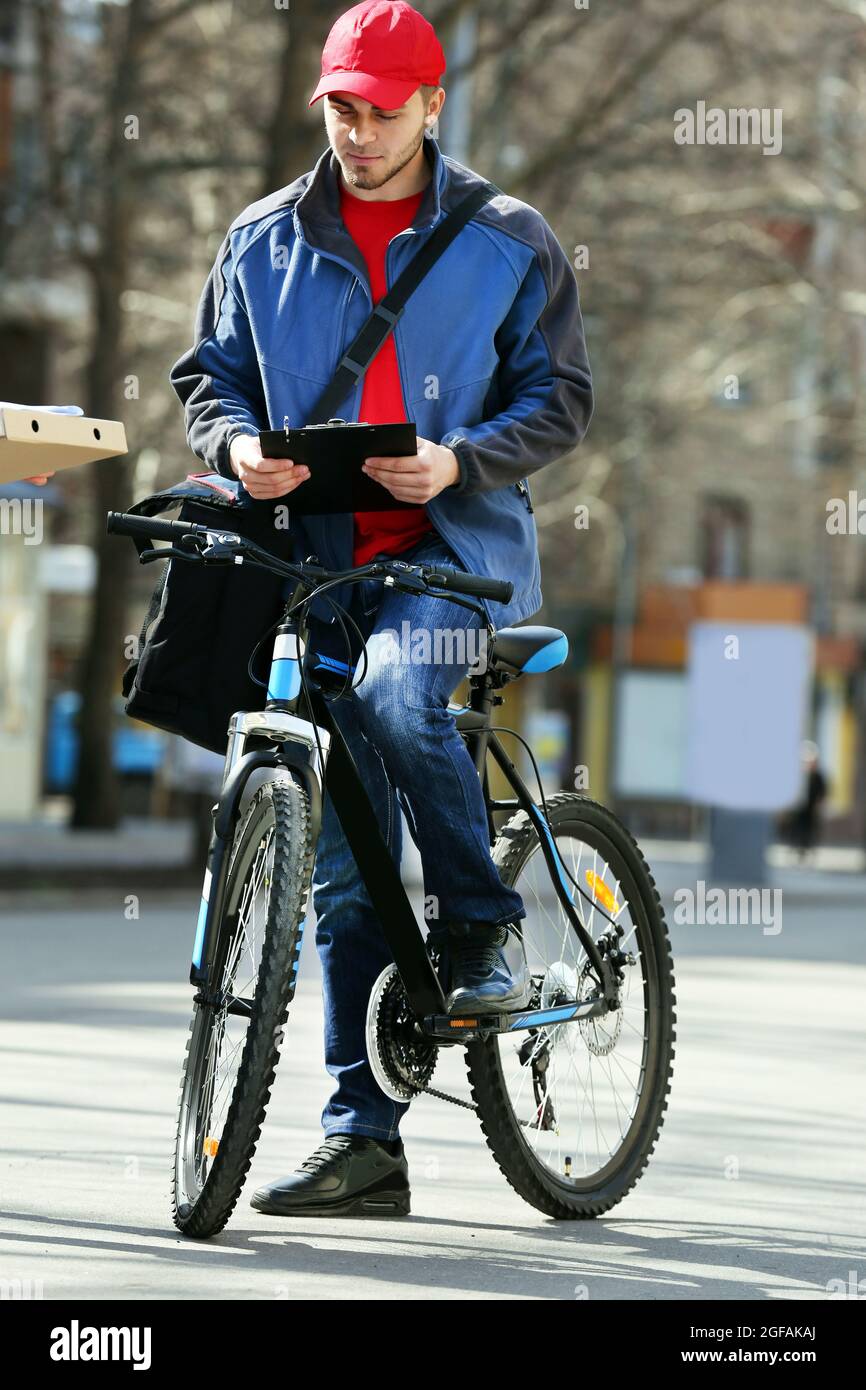 Young man with bike outside Stock Photo - Alamy