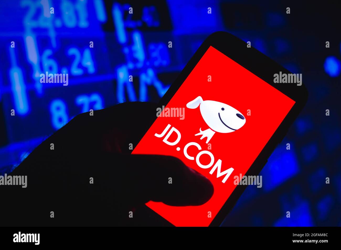 In this photo illustration the JD.com (Jingdong) logo seen displayed on ...