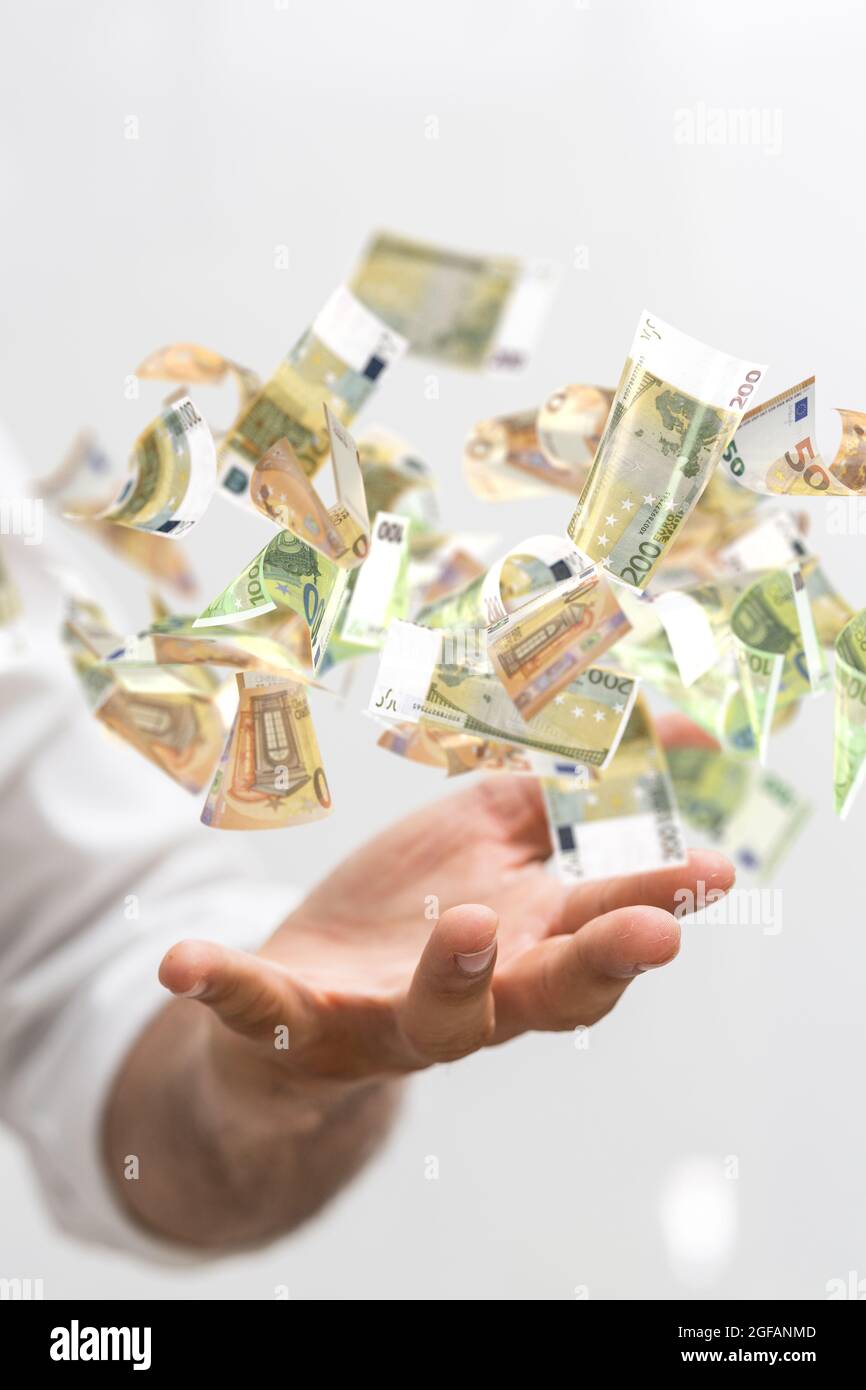 Falling Euro banknotes and coins isolated Stock Photo - Alamy