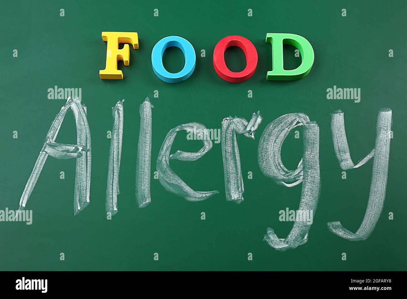 Text FOOD ALLERGY on blackboard background Stock Photo - Alamy