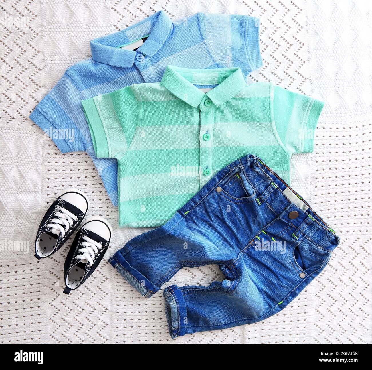 Baby clothes on fabric background Stock Photo - Alamy