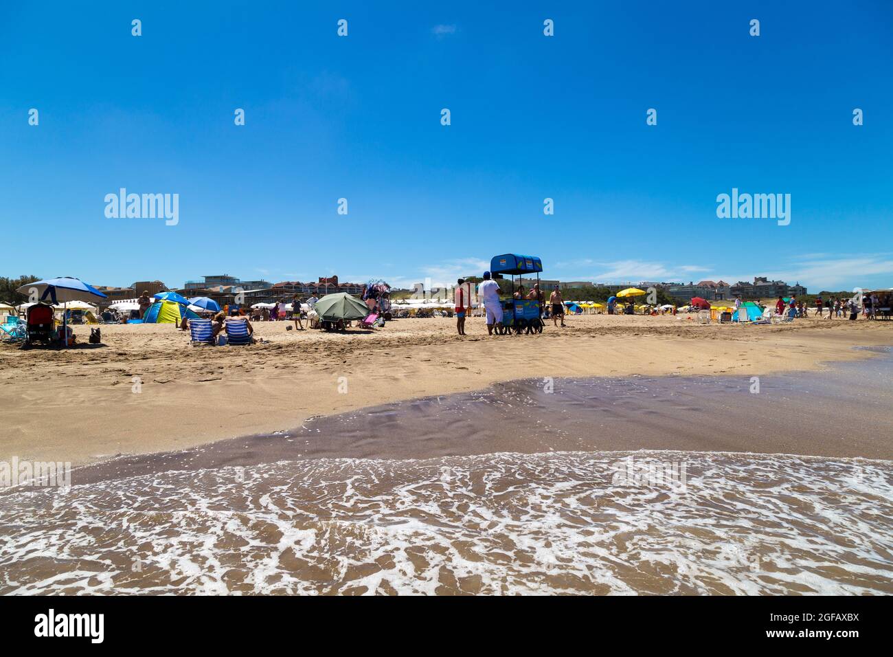 CARILO, BUENOS AIRES, ARGENTINA. The people enjoying the beach in a ...