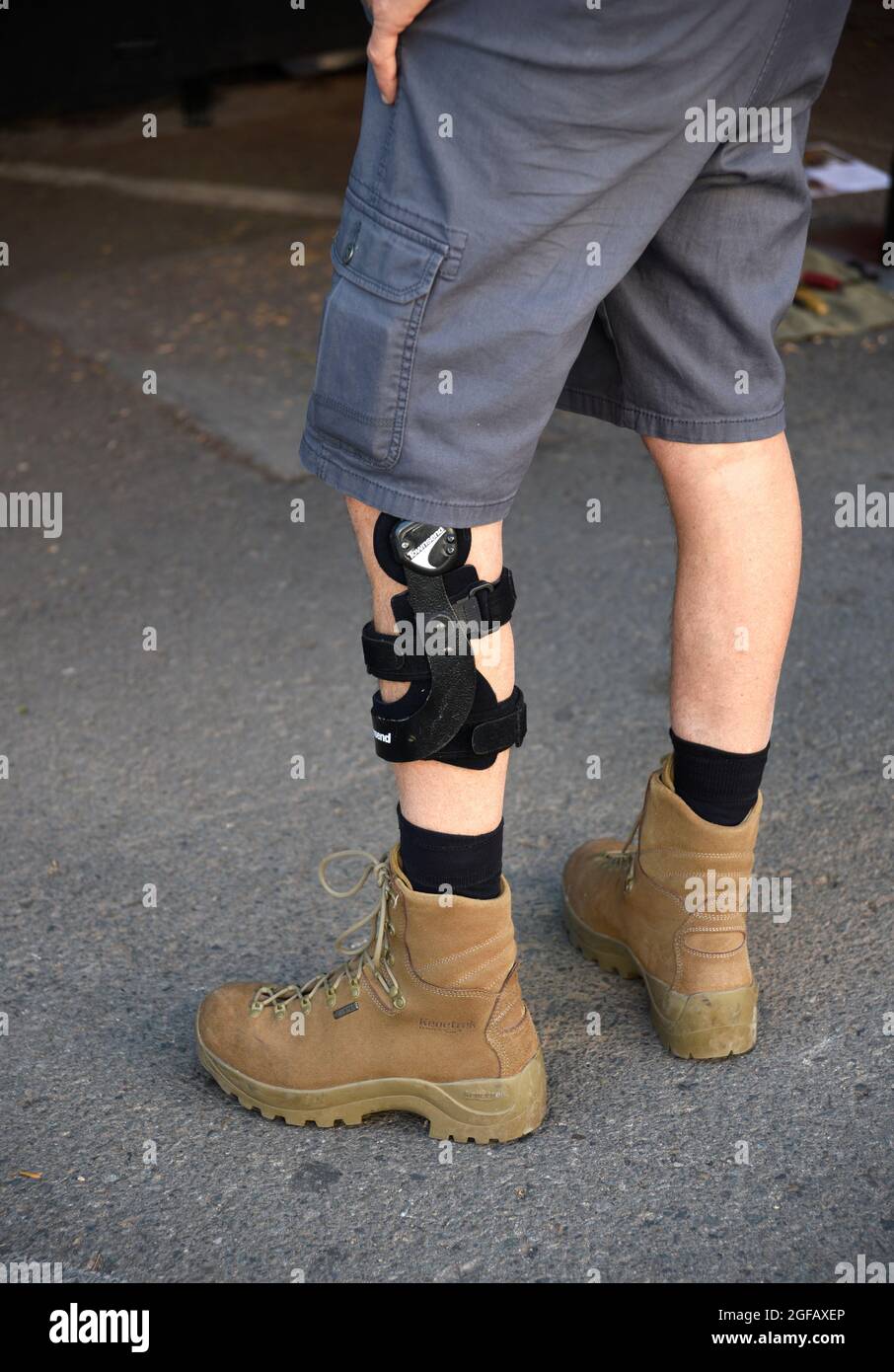 A man wearing a Townsend brand leg and knee brace visits an outdoor art ...