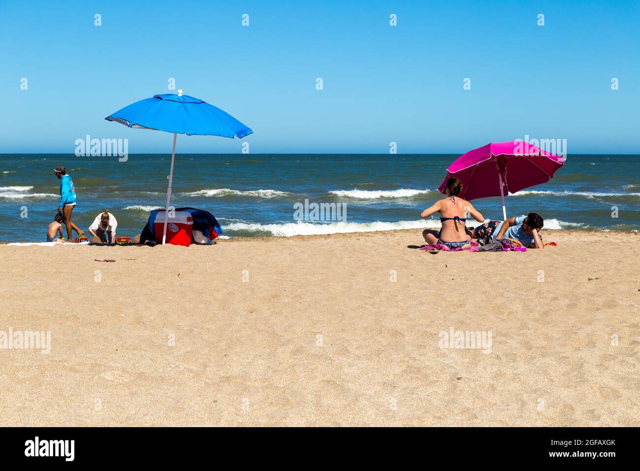 CARILO, BUENOS AIRES, ARGENTINA. The people enjoying the beach in a ...