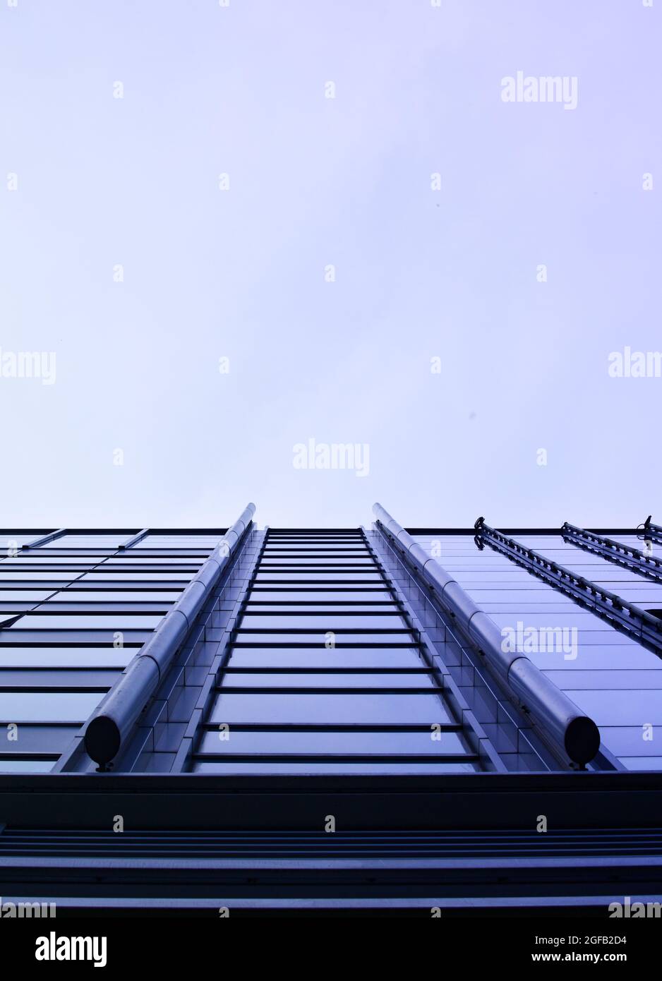 Low angle of a beautiful shiny modern high rise building in the city ...