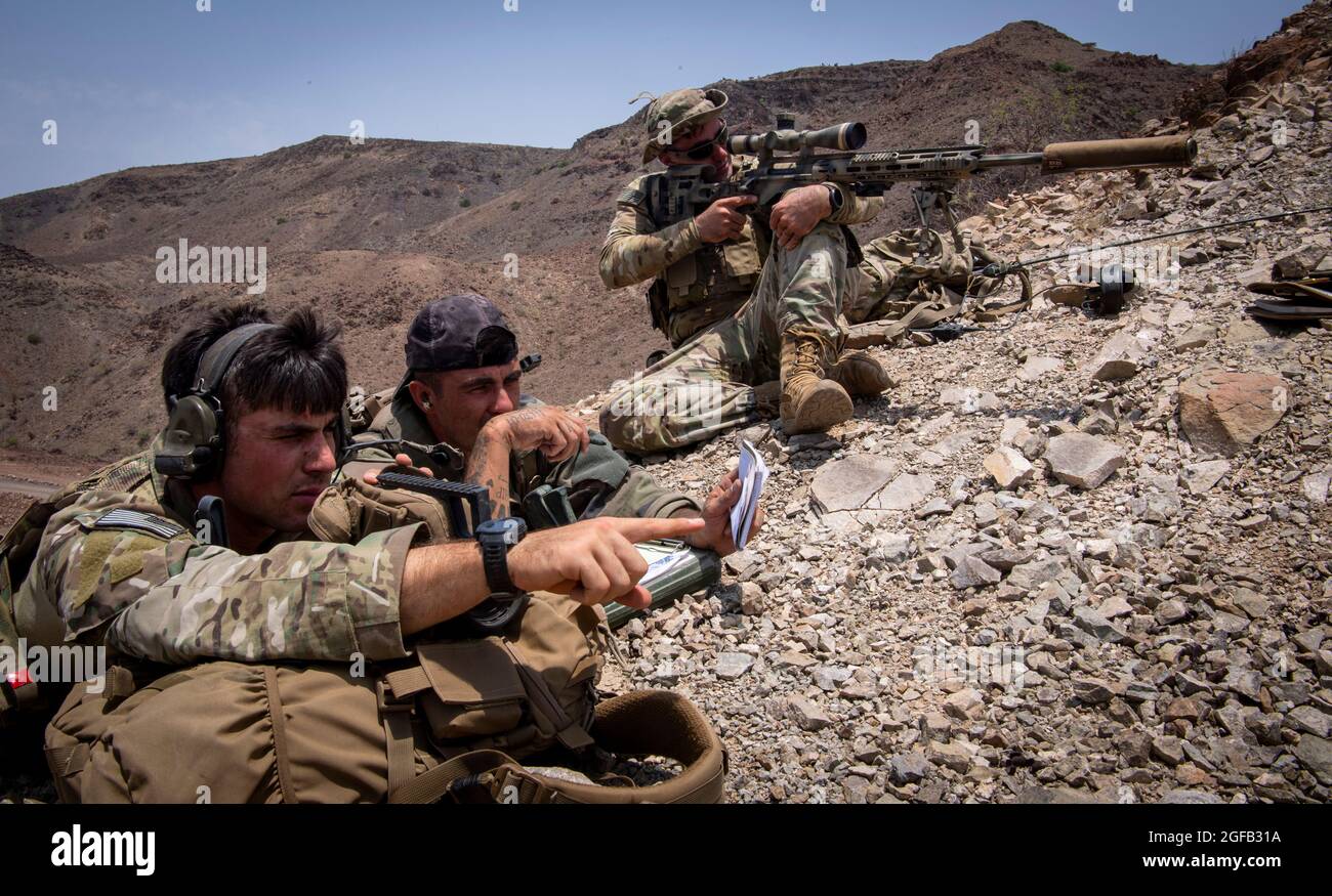 U.S. Army Staff Sgt. Luk Silk (left), Staff Sgt. Christopher Genovese ...