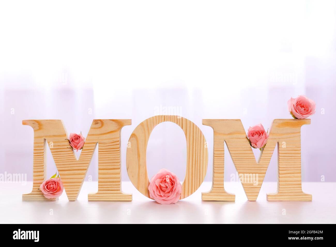 Mom word with flowers on light background. Mother Day concept Stock ...