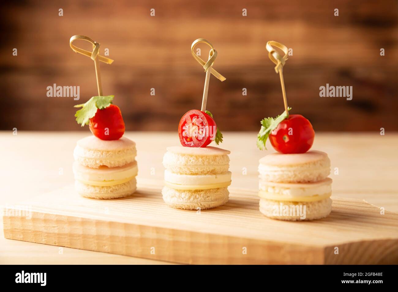 Close up of Delicious Party Snacks. Round mini sandwiches with ham and ...