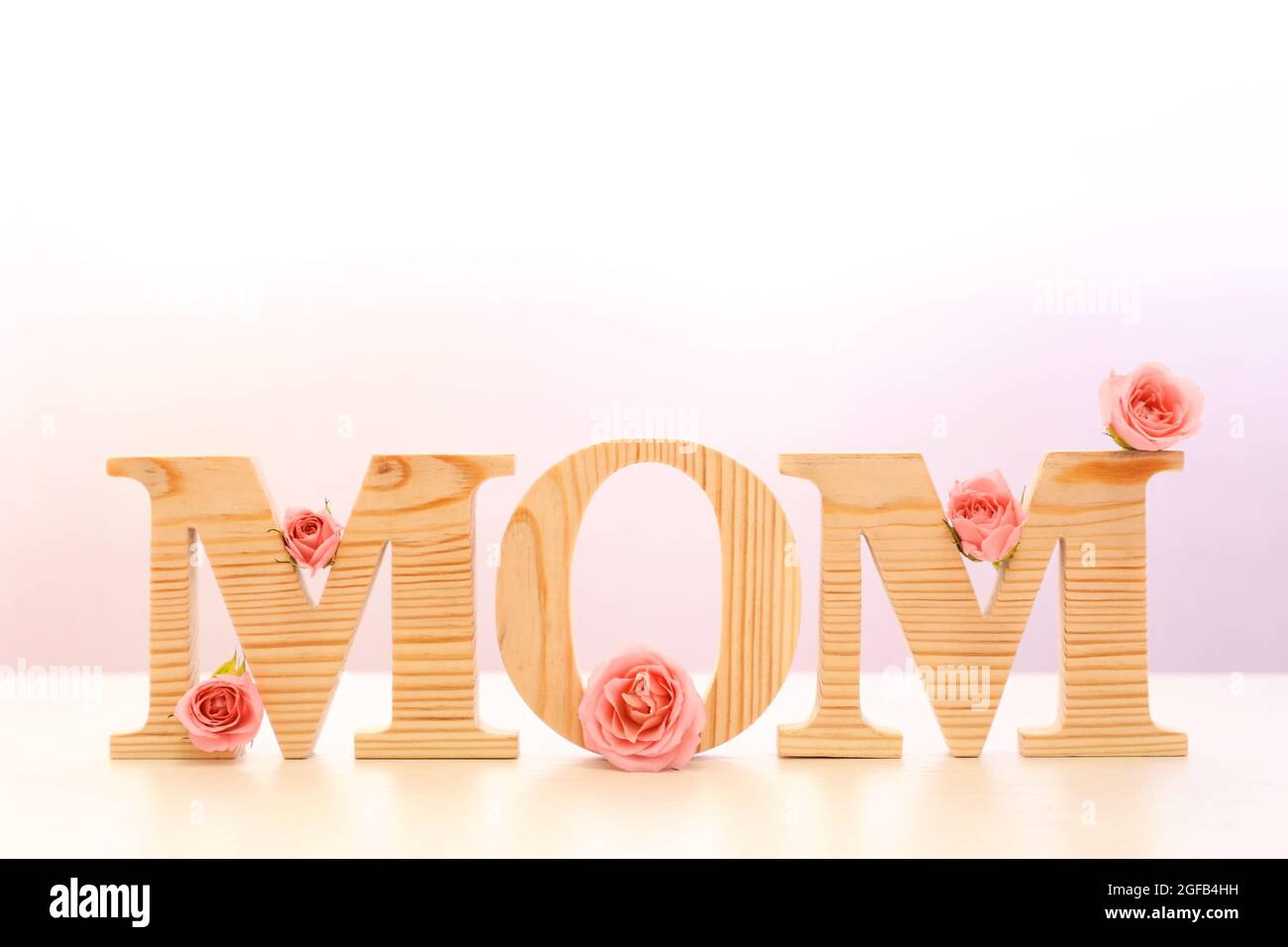 Mom word with flowers on light background. Mother Day concept Stock ...