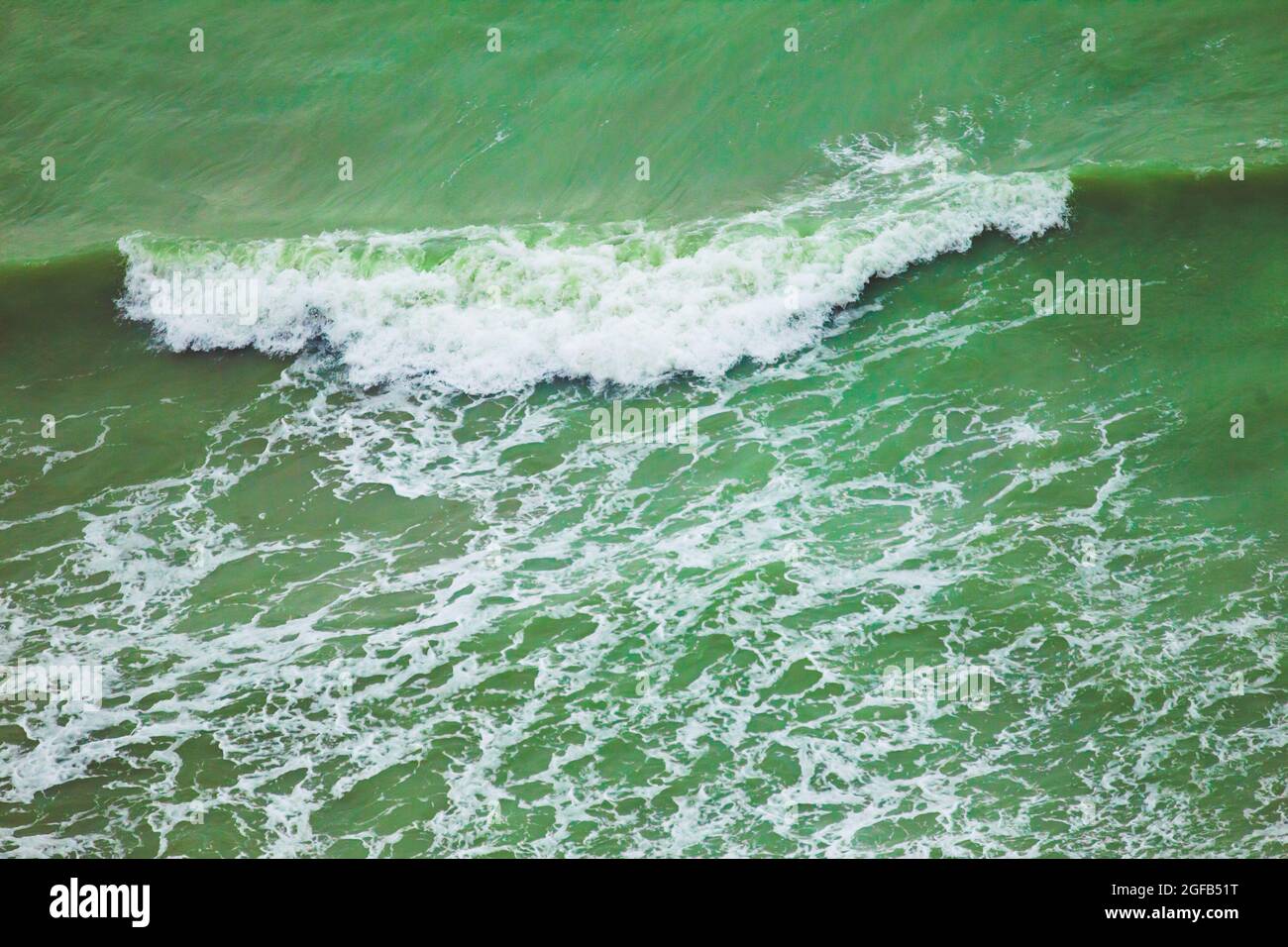 Aerial view of green wavy sea on a sunny day Stock Photo - Alamy