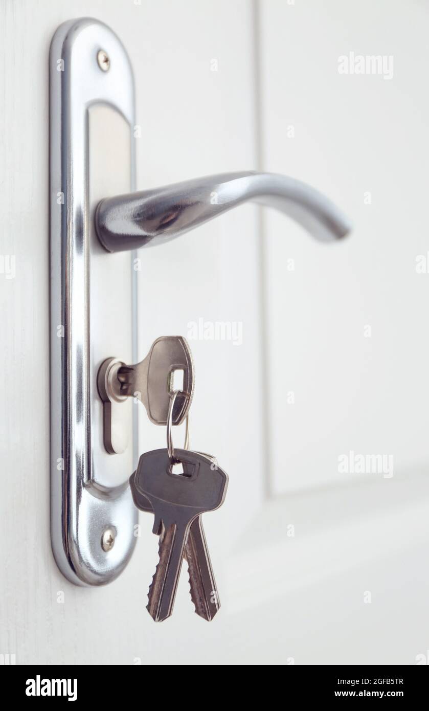 Metal door knob and keys closeup Stock Photo - Alamy