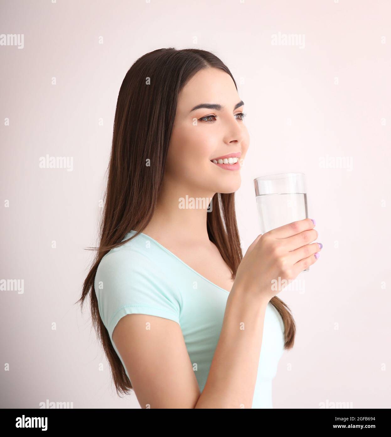 Beautiful girl drinking water Stock Photo - Alamy