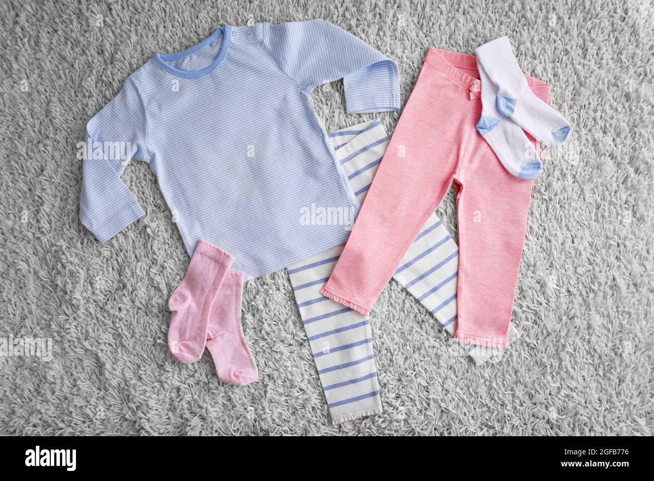 Child clothes on light background Stock Photo - Alamy