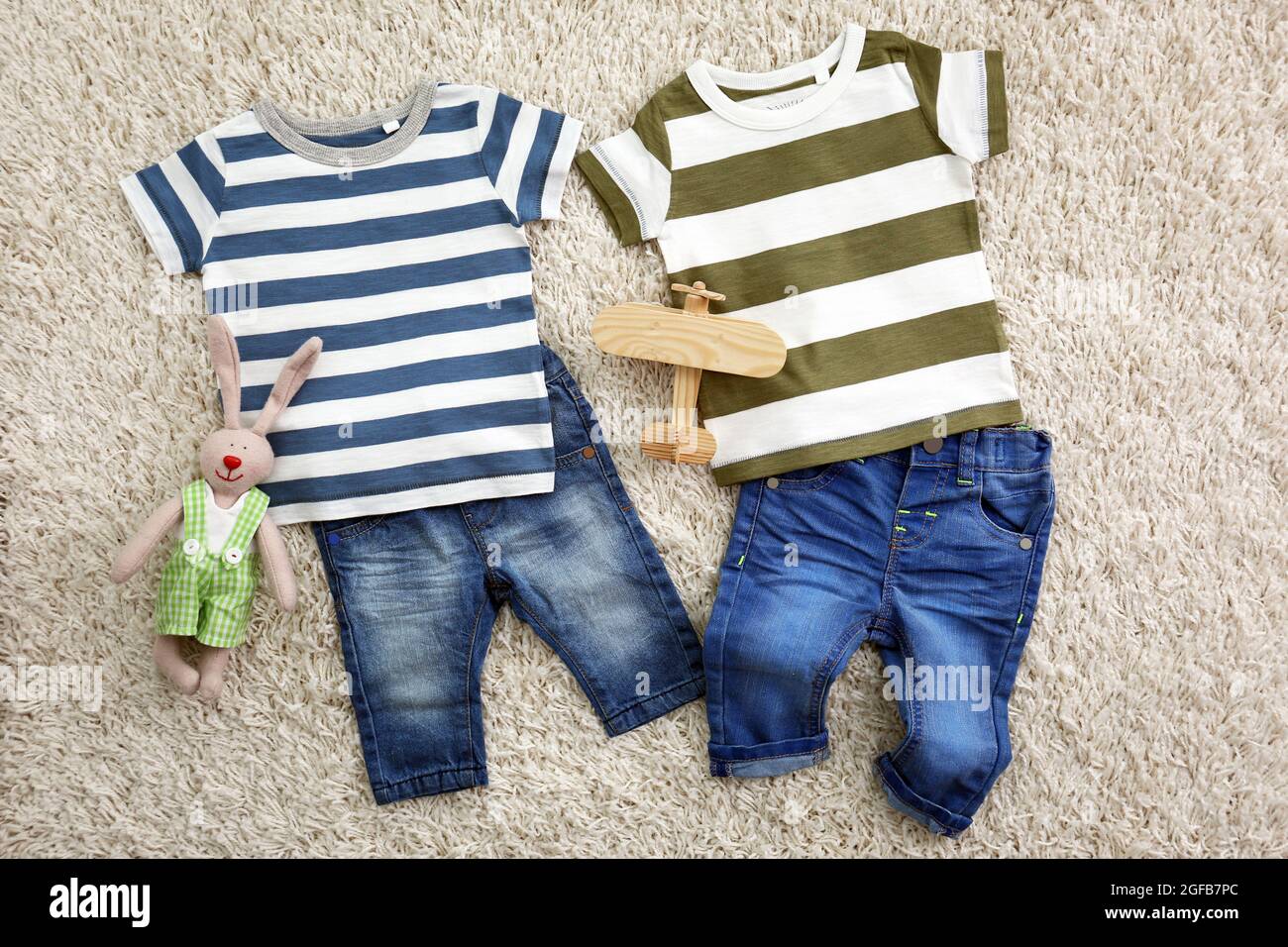 Child clothes on light background Stock Photo - Alamy