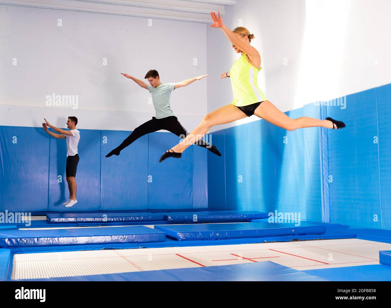 People jumping in trampoline center Stock Photo - Alamy