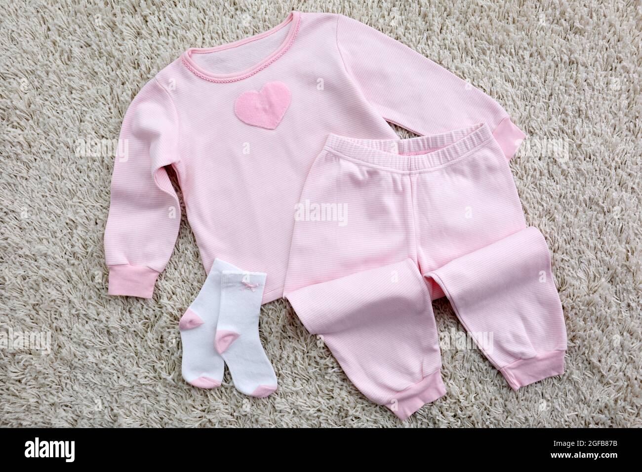 Baby clothes on light background Stock Photo - Alamy