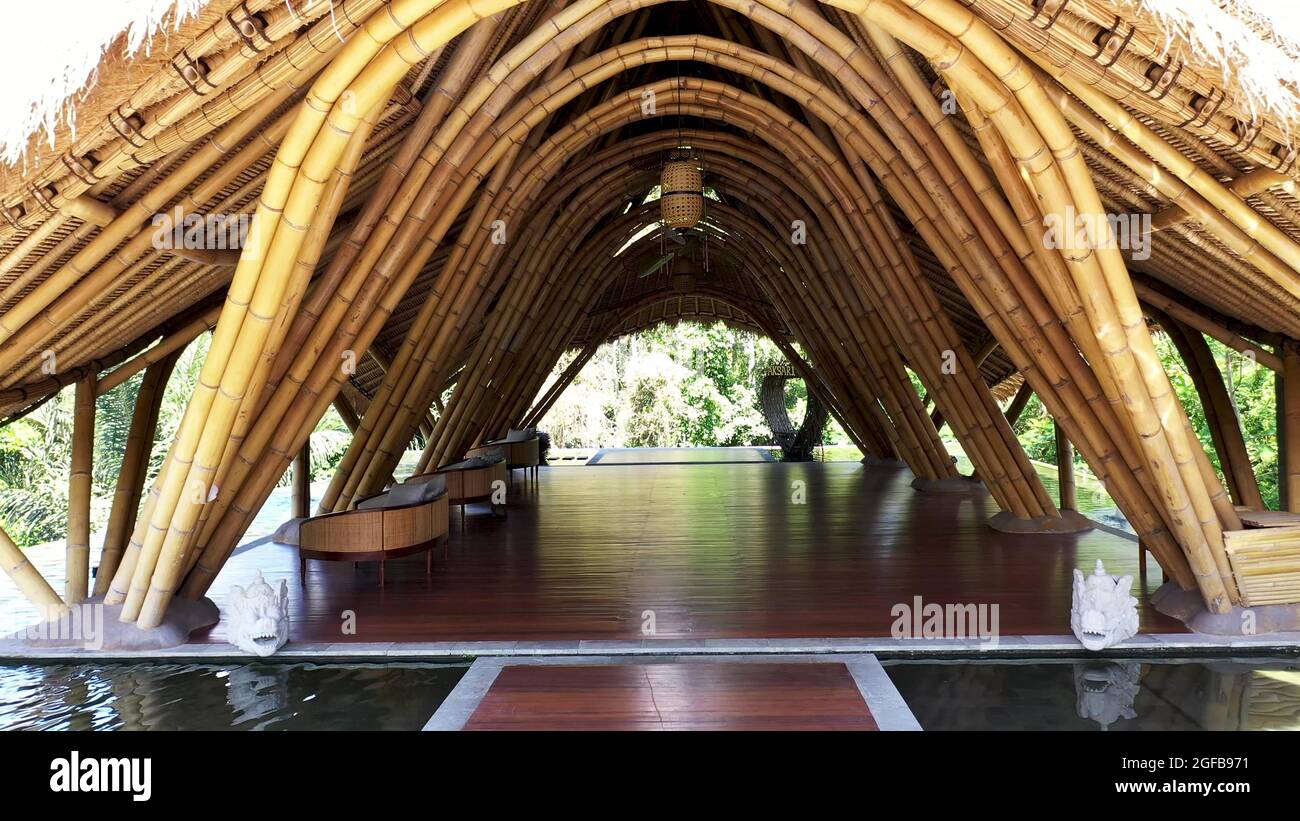 fly through a bamboo shed with a reed roof in Ubud, Bali. Aerial view ...