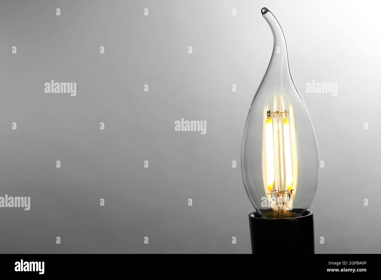 Light bulb on grey background Stock Photo - Alamy