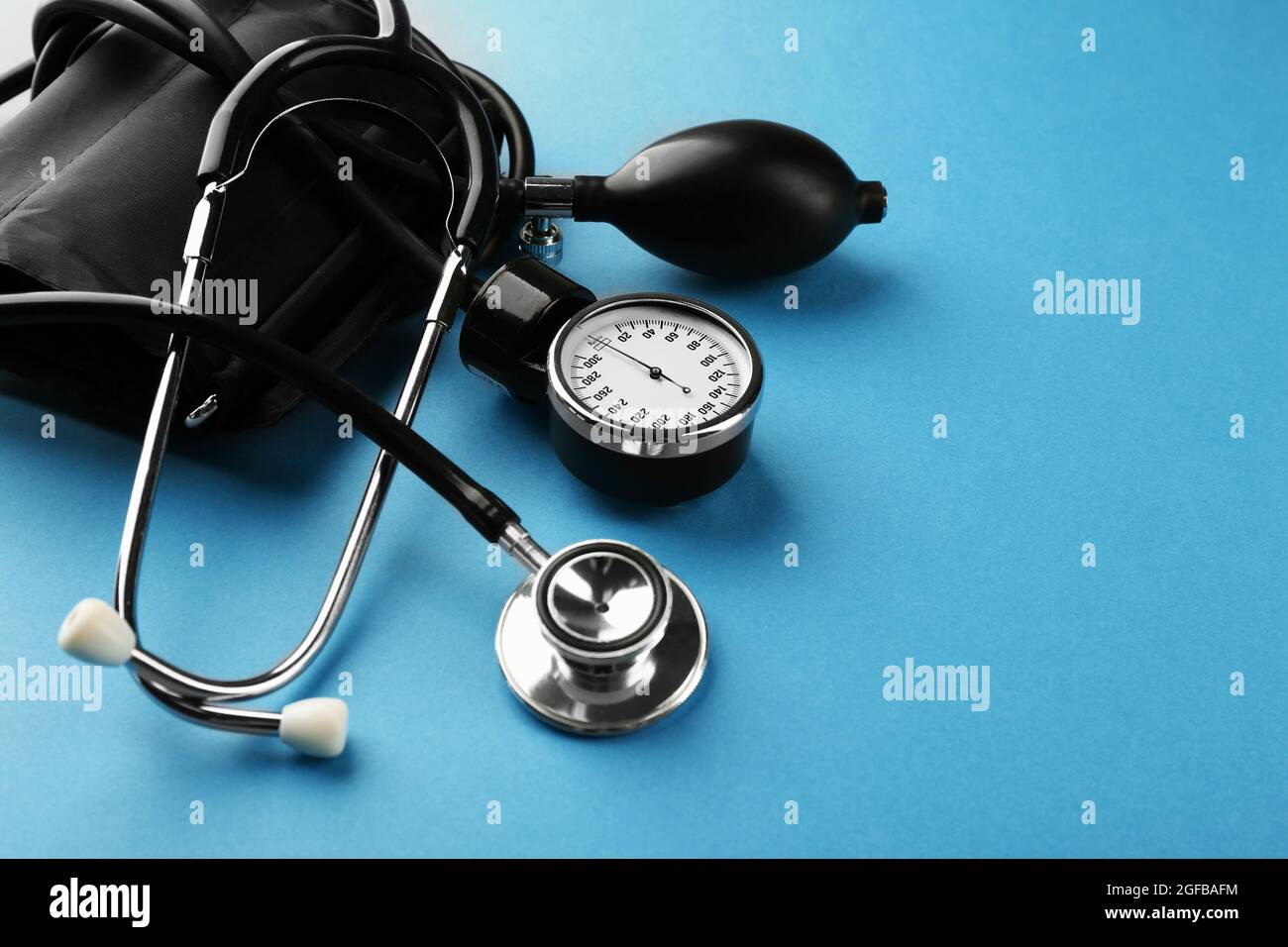 Medical manometer and a stethoscope on blue background Stock Photo - Alamy