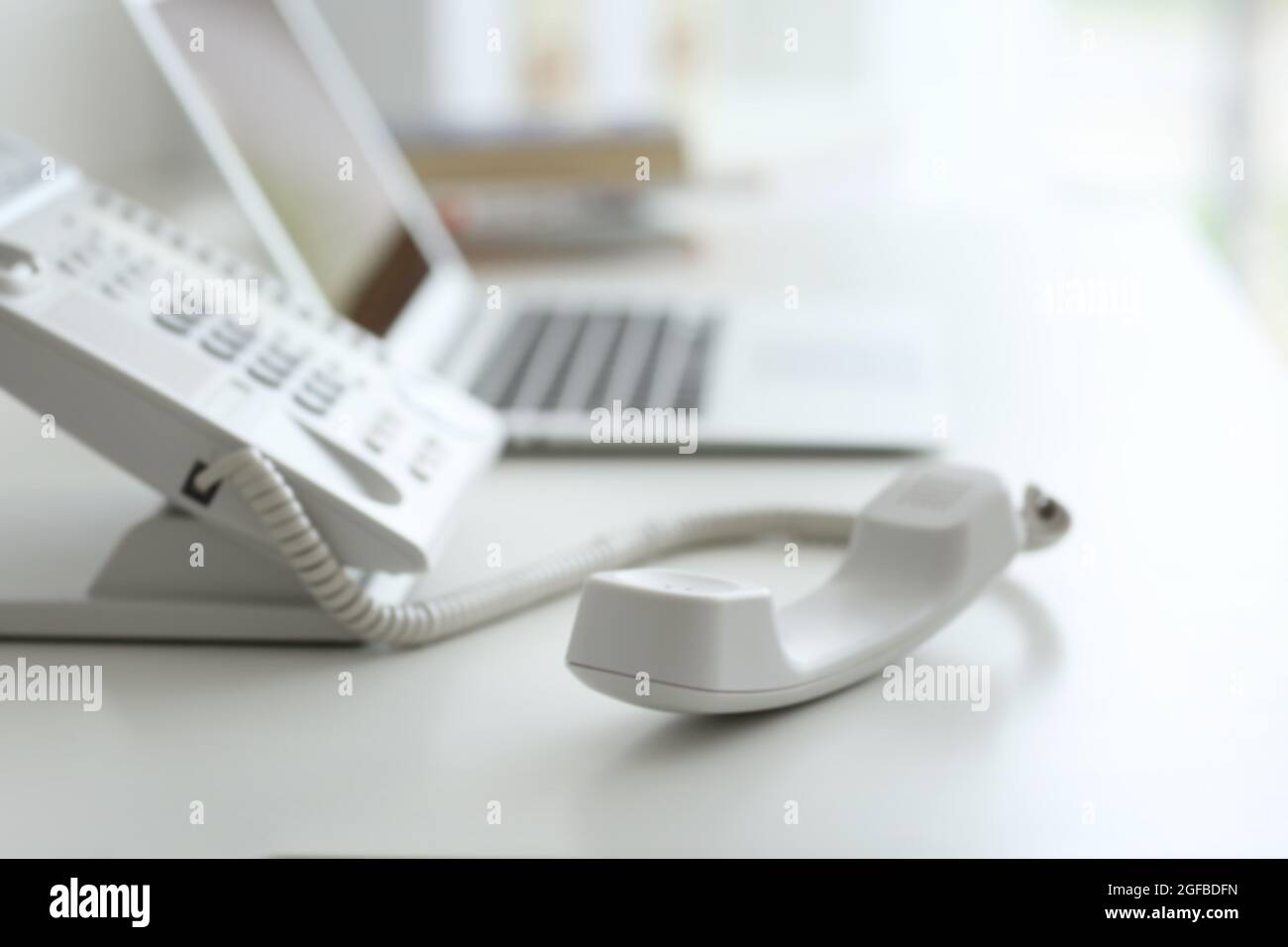 Office IP telephone on light background Stock Photo - Alamy
