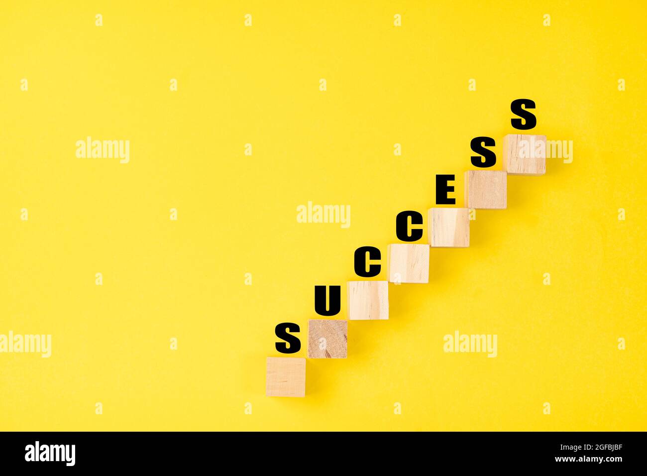 Wooden blocks arranged like stairs with text success. Business concept ... Wooden blocks arranged like stairs with text success. Business concept ...
