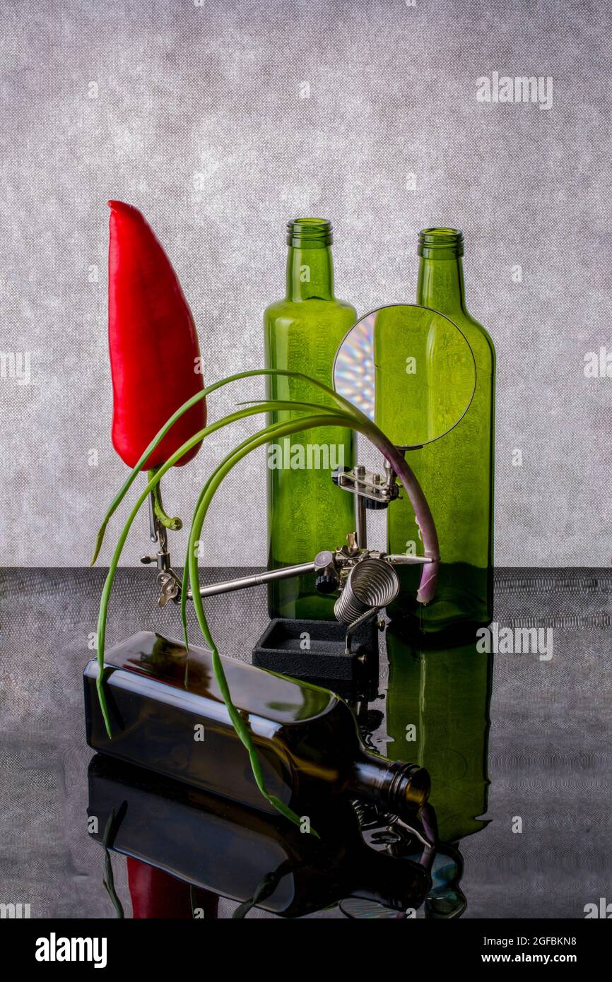 Still life with red pepper, onions and and glass bottles Stock Photo ...