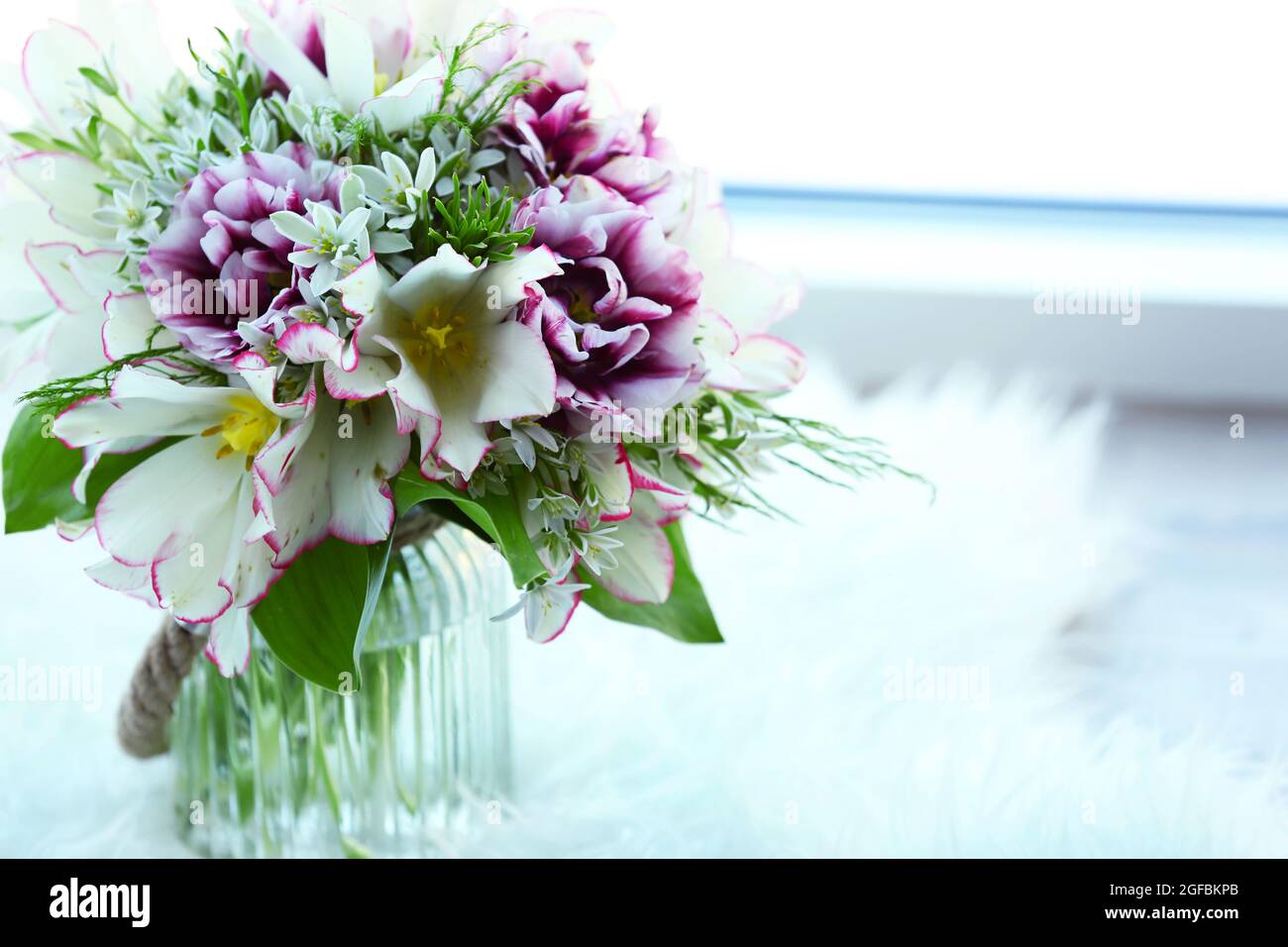 Bouquet of spring flowers on carpet Stock Photo - Alamy