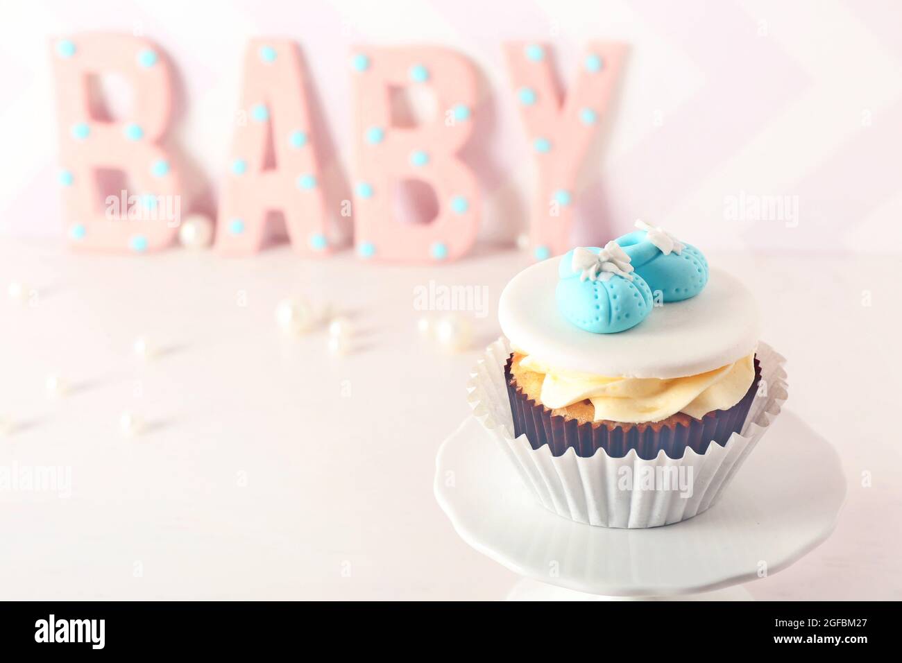 Word "Baby" with cupcake on light background Stock Photo - Alamy