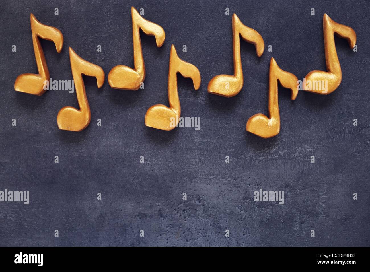 Music notes on dark grey background Stock Photo - Alamy