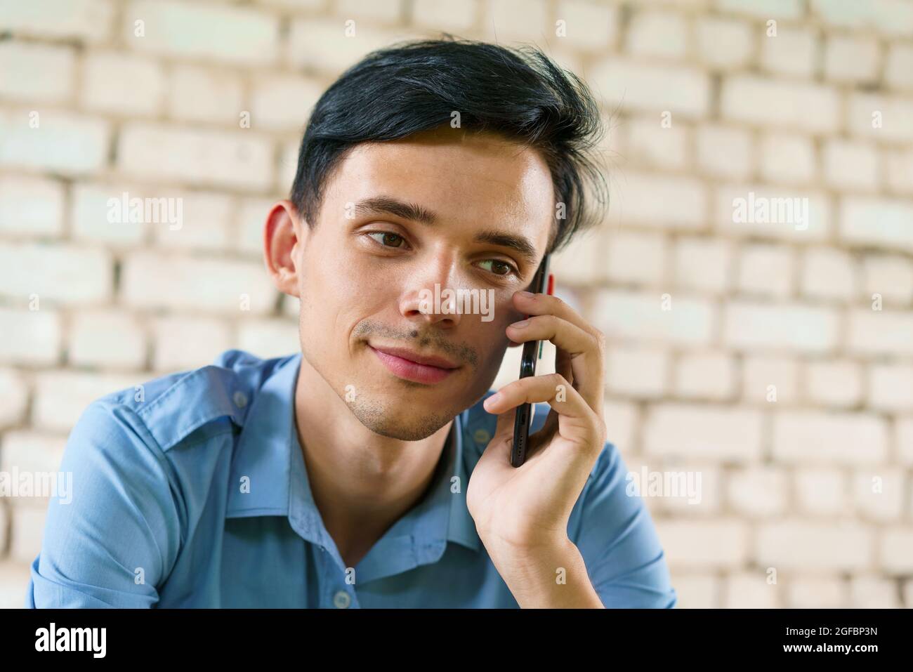 The guy is talking on the phone, close-up. Caucasian young brunette man ...