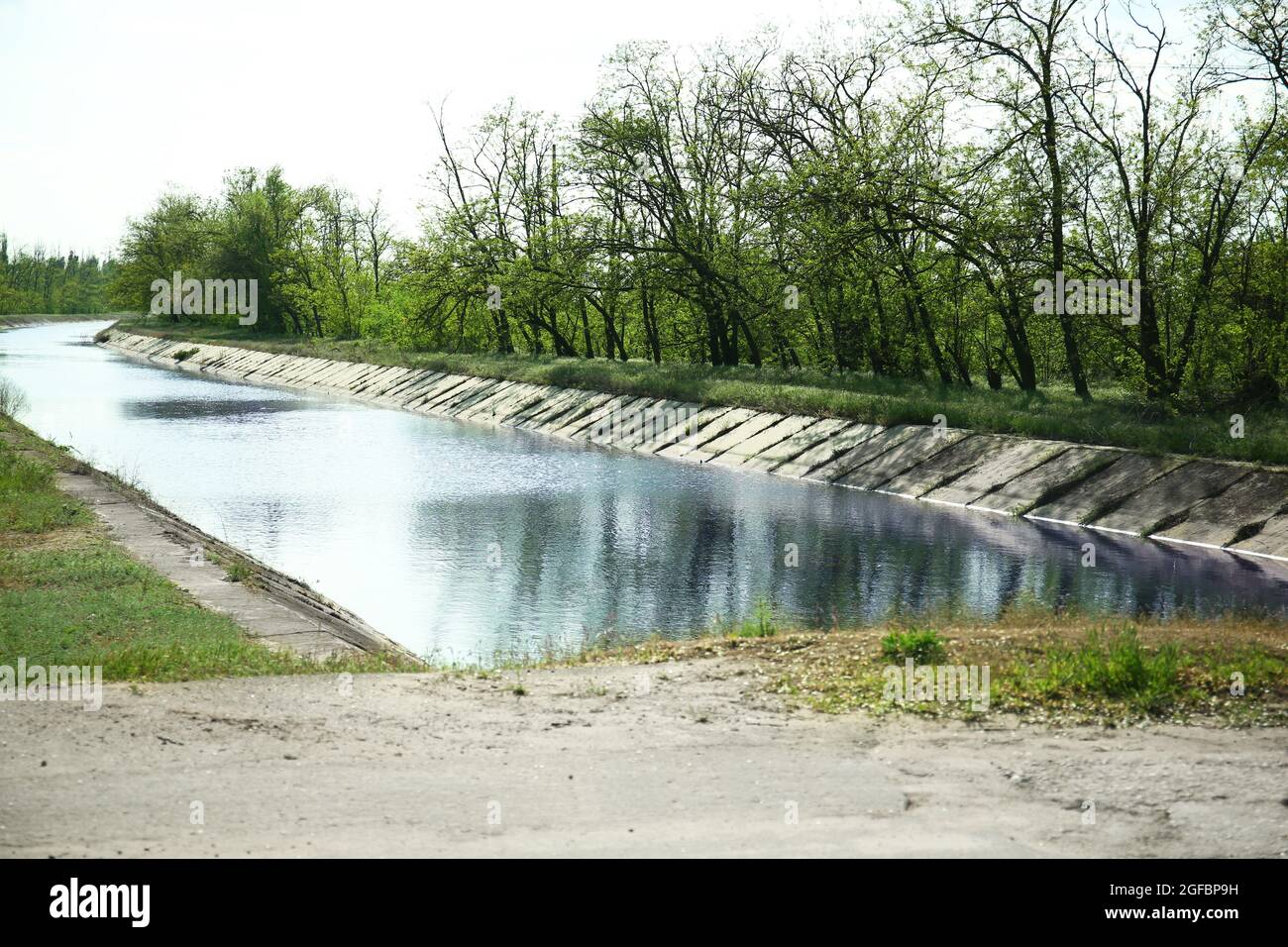 Canal supply water in irrigation Stock Photo - Alamy