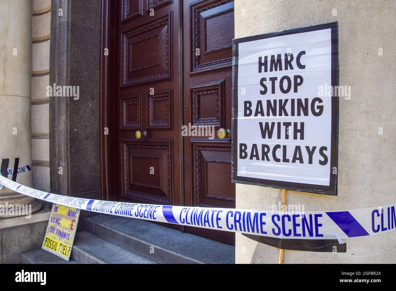 London, UK. 24th Aug, 2021. Demonstrators leave a 'Climate Crime Scene ...