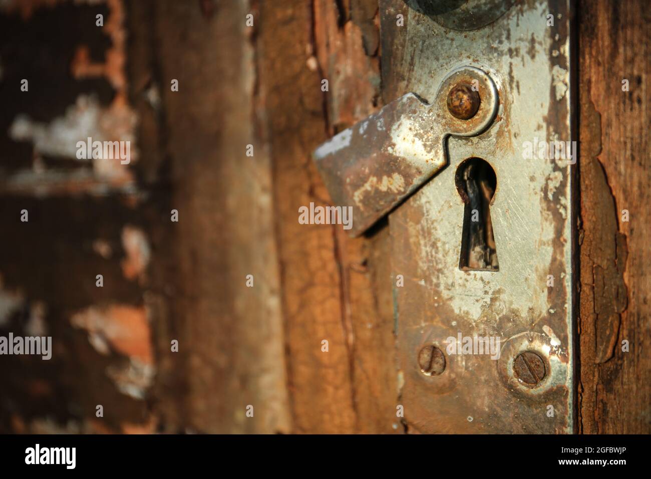 Lock hole on the old door Stock Photo - Alamy