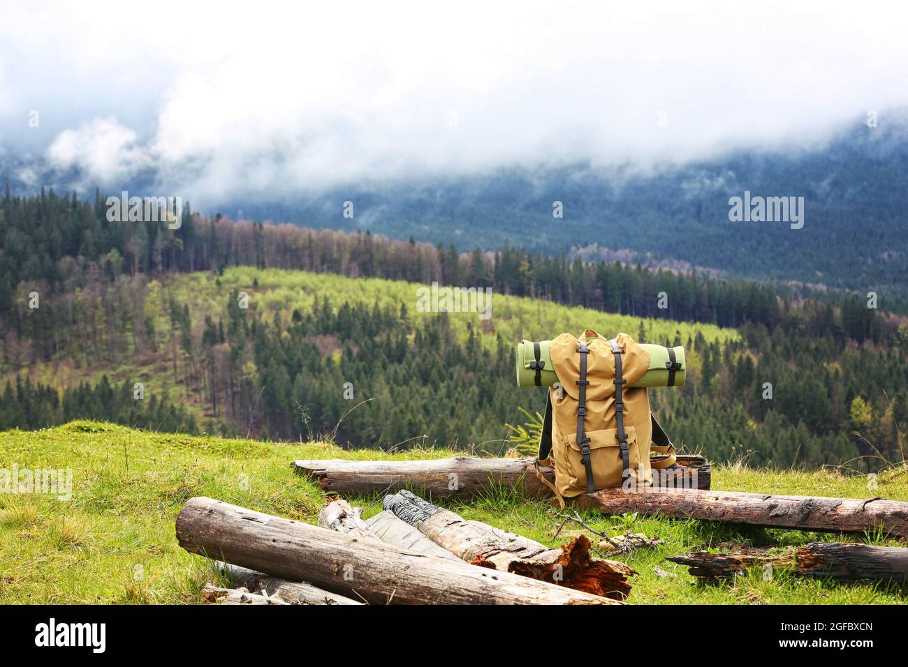 Tourist beg pack on mountain slope Stock Photo - Alamy