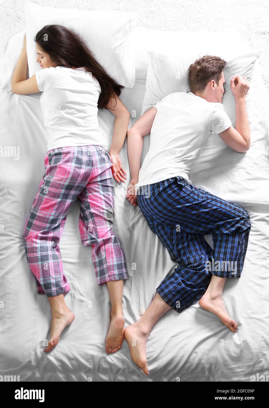 Sleeping couple, top view Stock Photo - Alamy