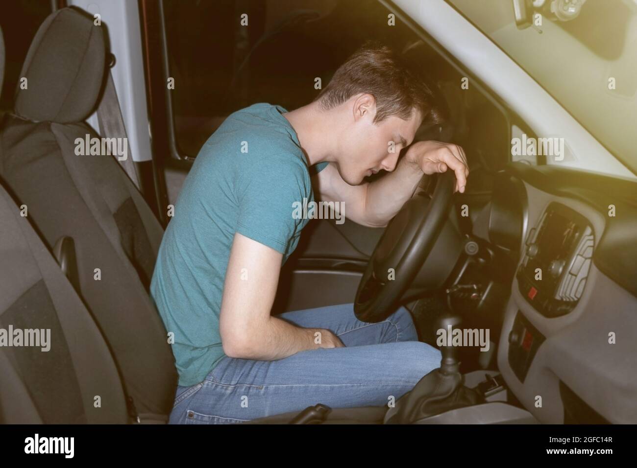 Handsome young man sleeping in car hi-res stock photography and images ...