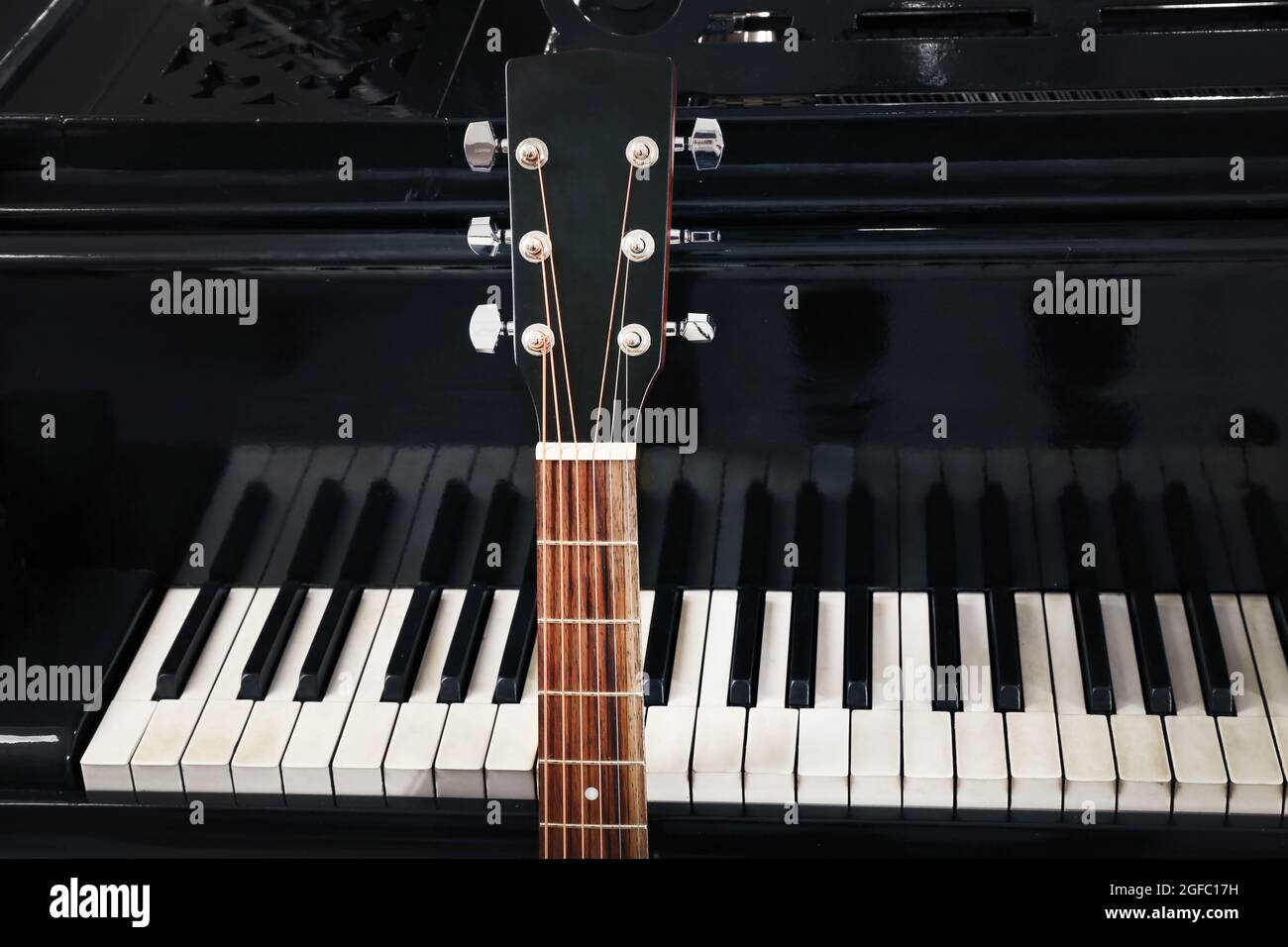 Guitar with piano, close up Stock Photo - Alamy