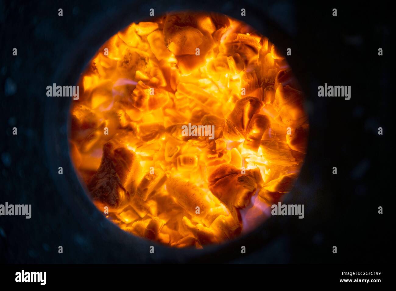 Embers from the burning of wood in a stove Stock Photo - Alamy