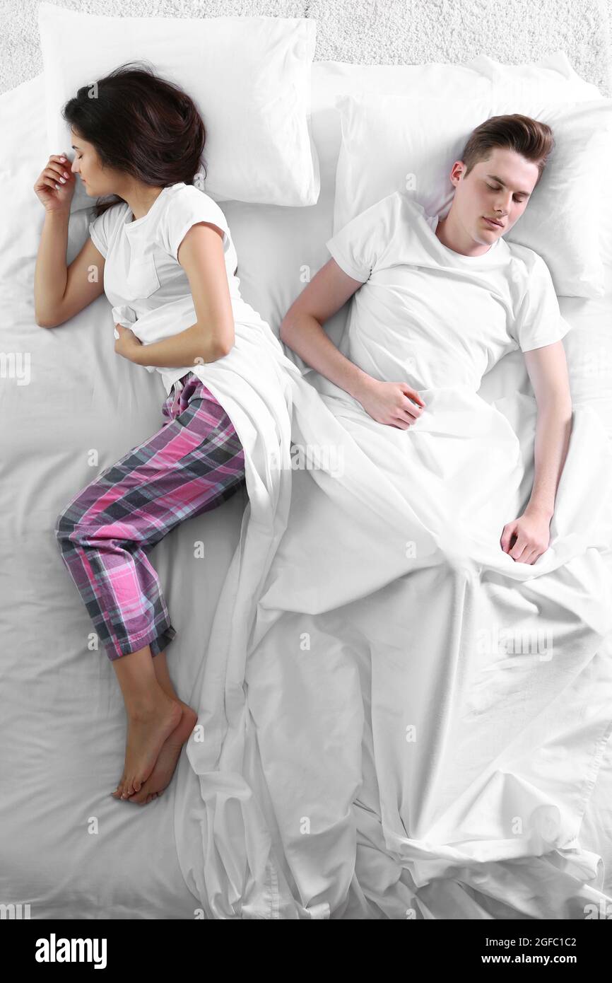 Sleeping couple, top view Stock Photo - Alamy