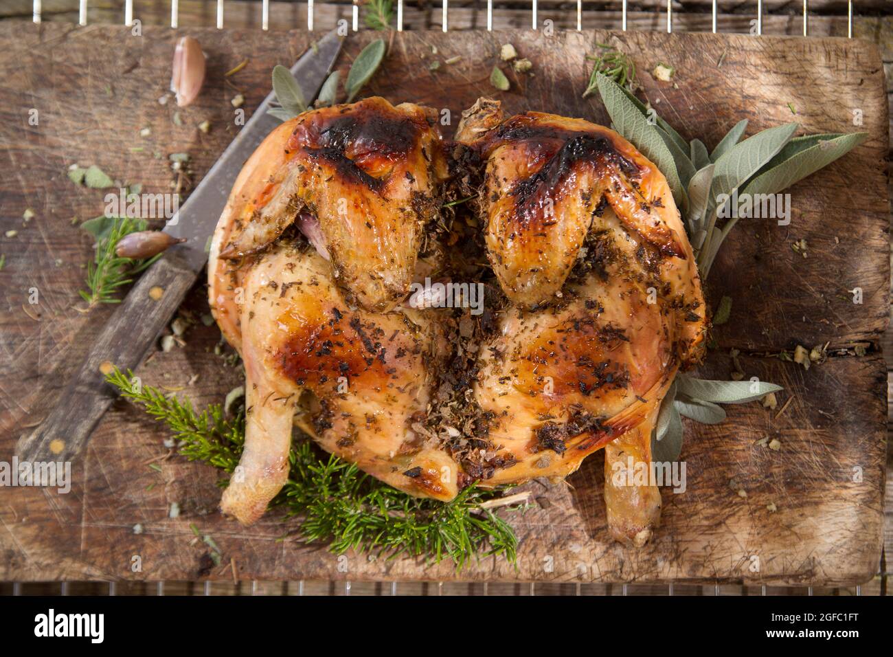 Presentation of a marinated chicken with herbs and baked in the oven ...