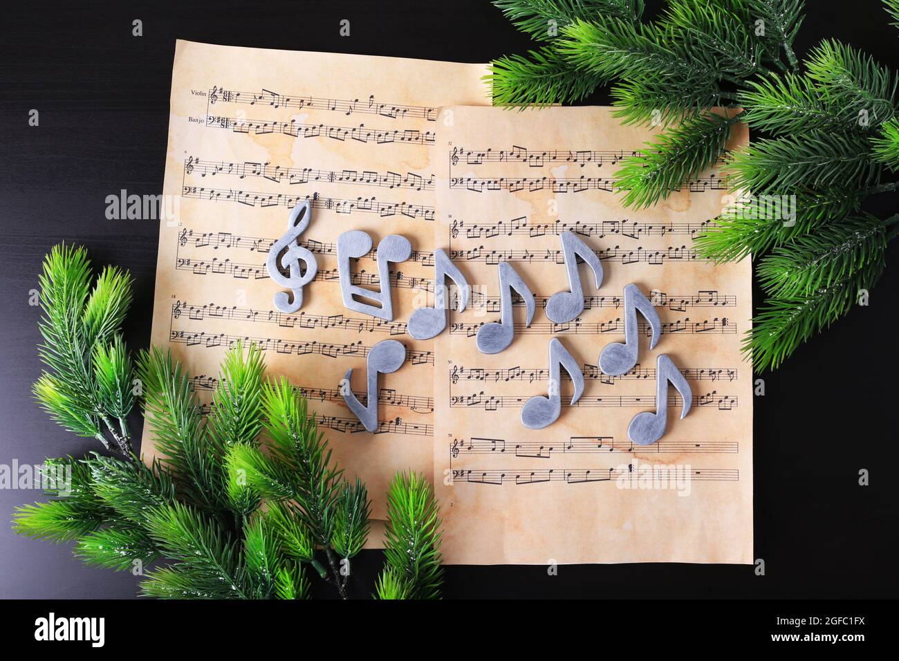 Christmas treble clef and music notes on paper background Stock Photo ...