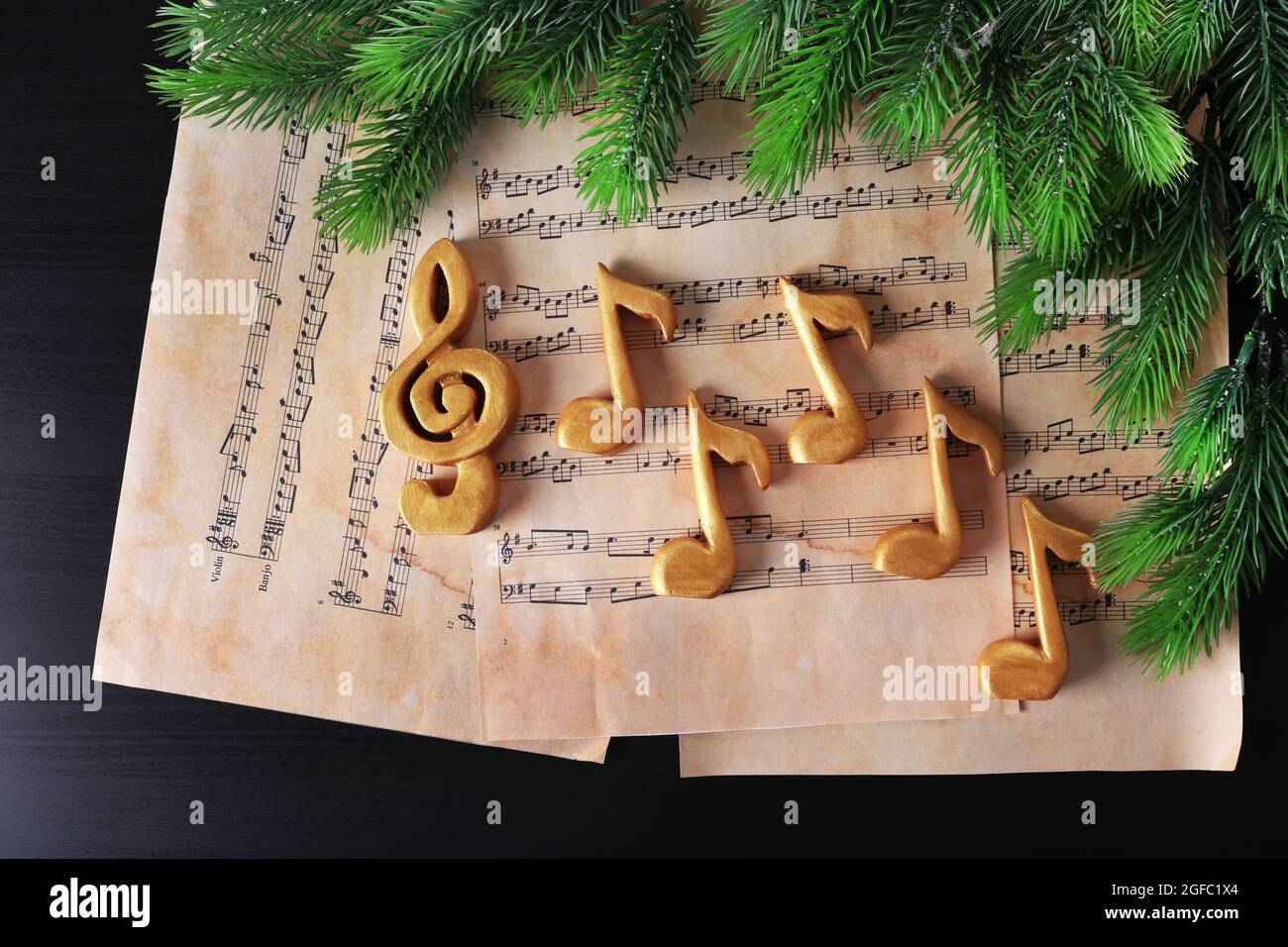 Christmas treble clef and music notes on paper background Stock Photo ...