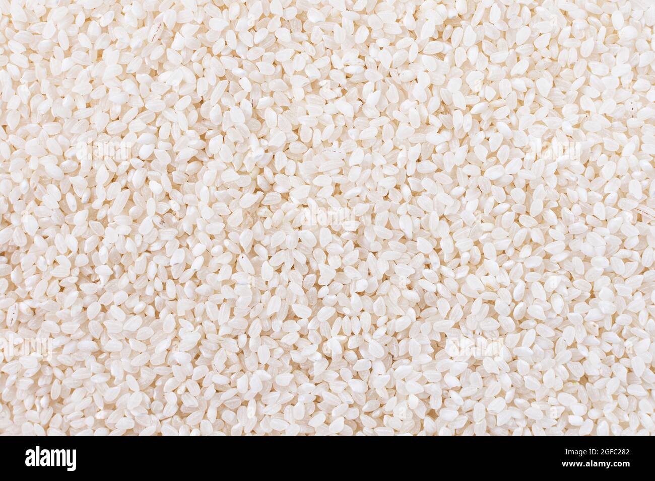 Heap of white sushi rice top view. Raw rice background. Food background ...