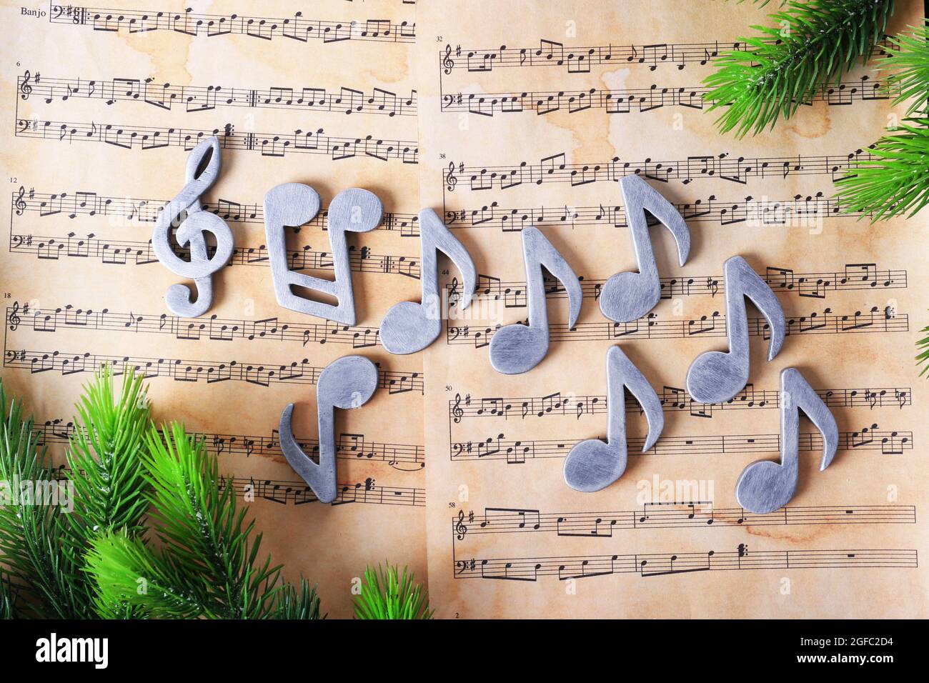 Christmas treble clef and music notes on paper background Stock Photo ...